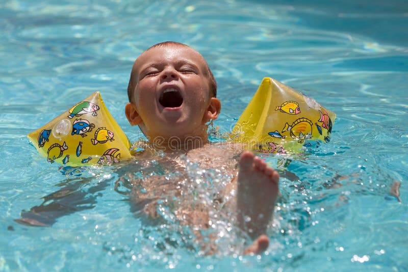 Young boy learning to swim stock photo. Image of swimming - 11208302