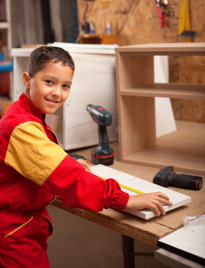 Boy Learning Wood Carving. Young Carpenter Working in a Workshop Stock ...