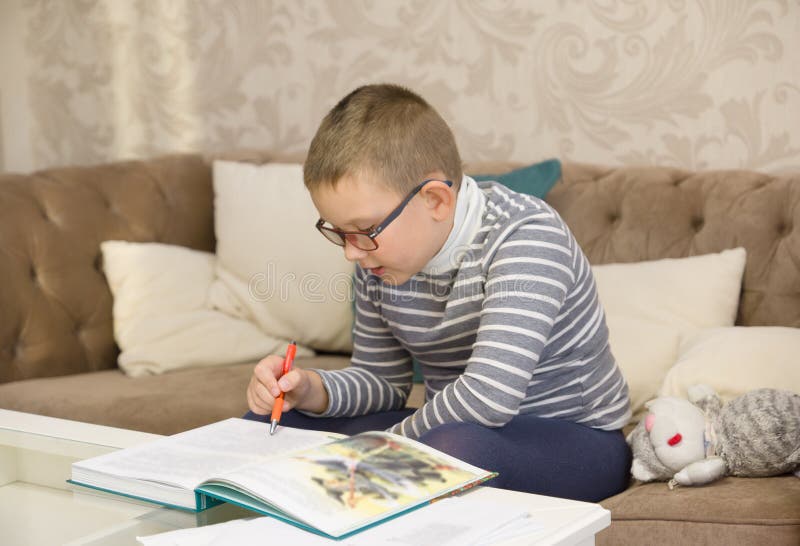 Boy Learns To Read a Big Book Stock Photo - Image of happiness, white ...