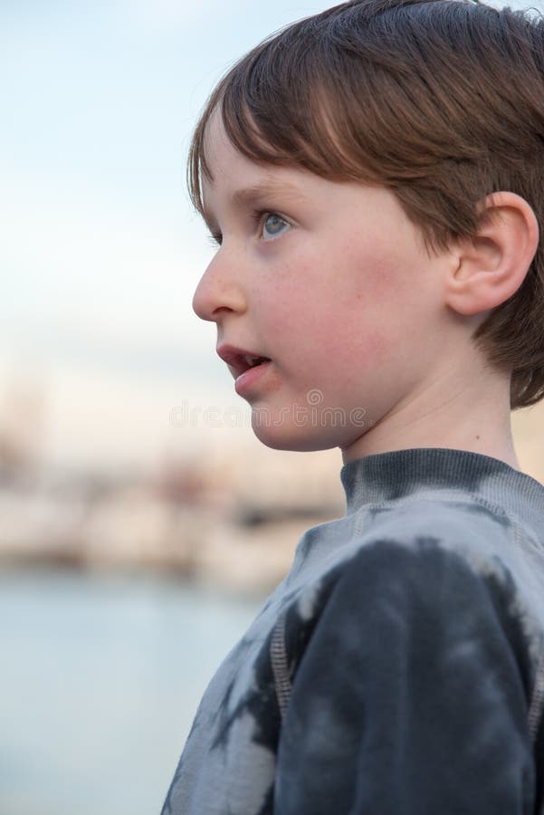 Young Boy Looking Off into the Distance Stock Image - Image of people ...