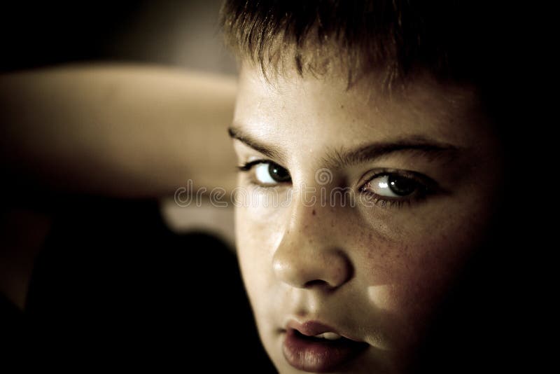 Young Boy Looking Up with Hope in His Eyes Low Key Stock Photo - Image ...
