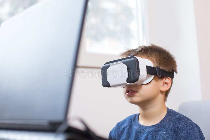 Young Boy Looking through VR Goggles Stock Photo - Image of play ...