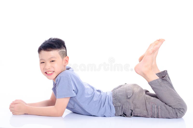 Handsome Young Boy Lying Down. Stock Image - Image of expression ...