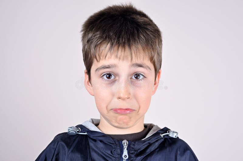 Young Boy Making a Funny Face Stock Photo - Image of grimace, gorgeous ...