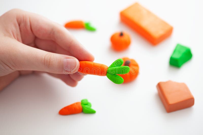 A Young Boy Making Polymer Clay Vegetables Stock Image - Image of ...