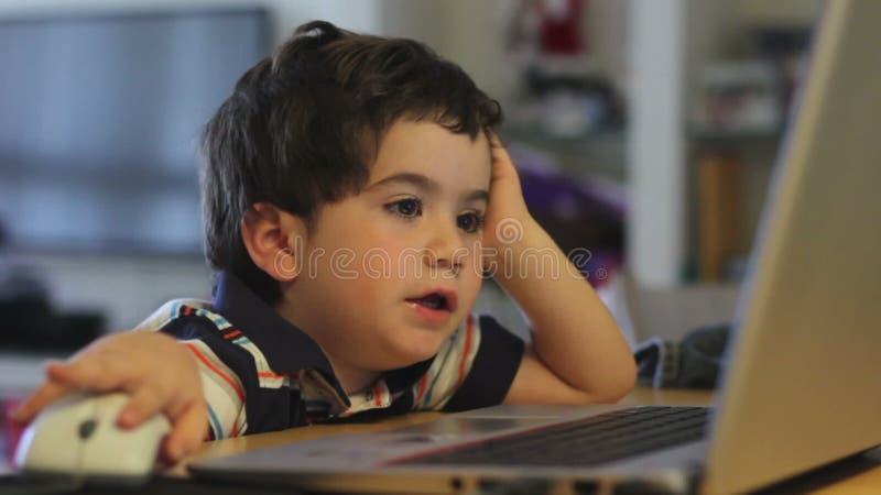 Young Boy Operating Educational Game on a Laptop Stock Video - Video of ...