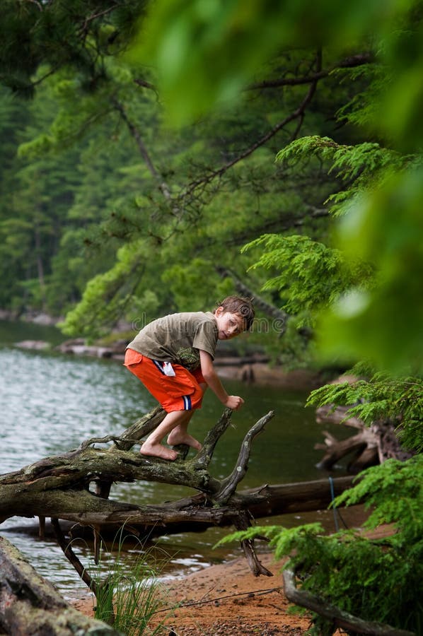 Young Boy Outdoors Exploring Stock Image - Image of male, adventure ...