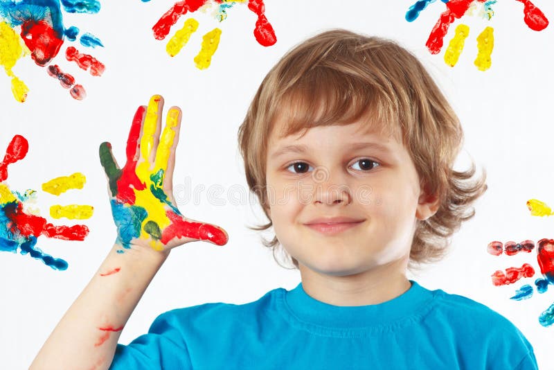 Young Boy with Painted Hands on Background of Hand Prints Stock Photo ...