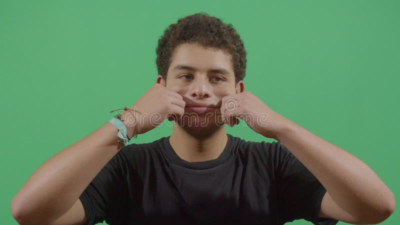 Young Boy Pinching Both Cheeks Stock Video - Video of leisure, mental ...