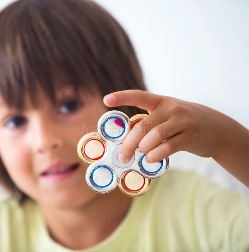 Young Boy Play with Fidget Spinner Stress Relieving Toy Stock Image ...