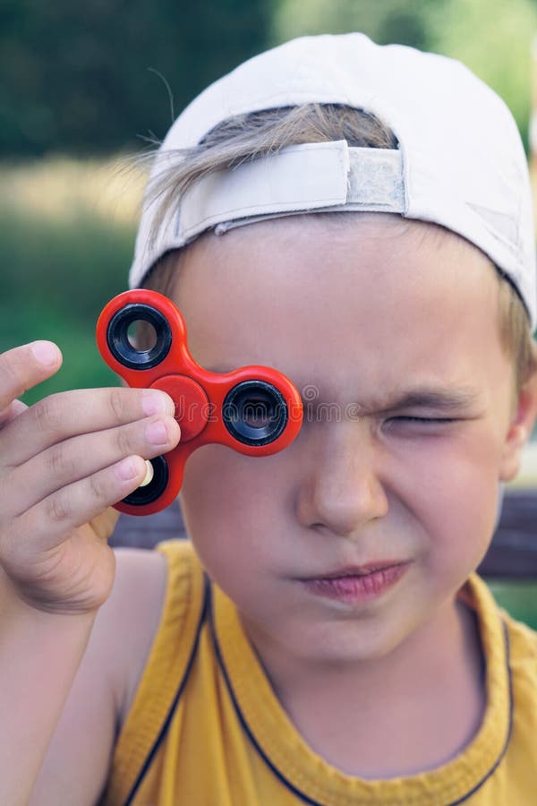 Young Boy Play with Fidget Spinner Stress Relieving Toy Stock Image ...