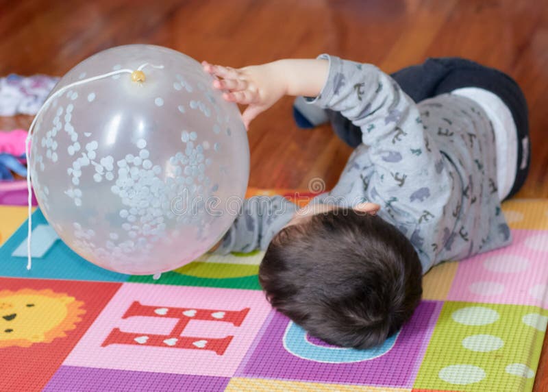 Young Boy Playing with a Balloon in His Room Stock Image - Image of ...