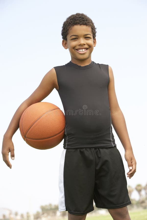 Young Boy Playing Basketball Stock Photo - Image of child, person: 12406208