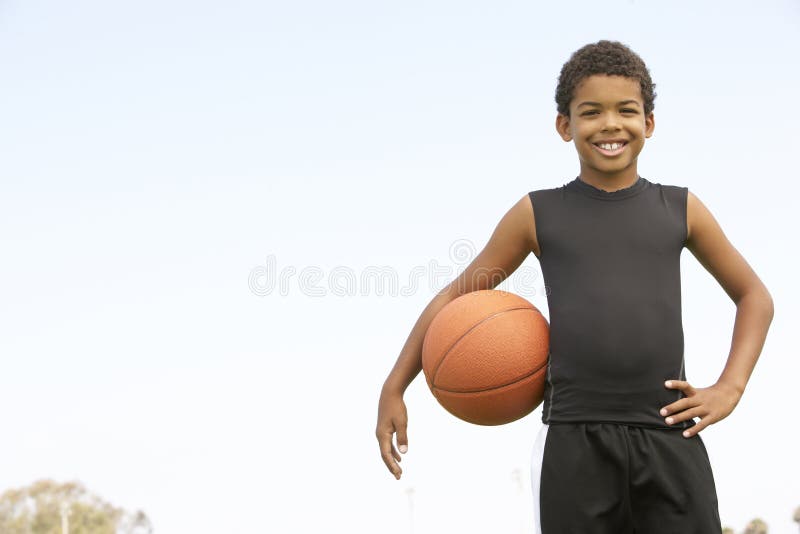 Young Boy Playing Basketball Stock Image - Image of young, recreation ...