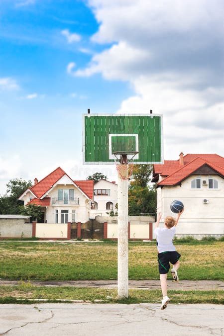 Young Boy Playing Basketball Alone Stock Image - Image of team, playing ...
