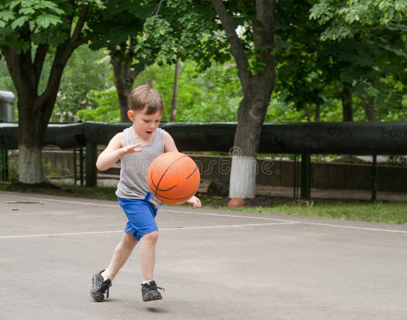Young Boy Playing Basketball Stock Image - Image of court, summer: 42875499