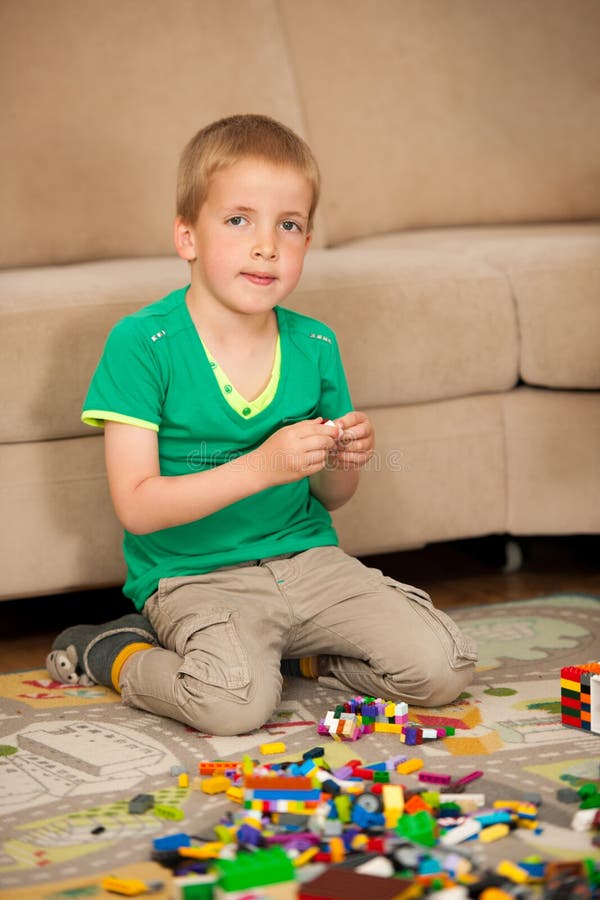 Young Boy Playing with Blocks on the Ground in Living Room Stock Image ...