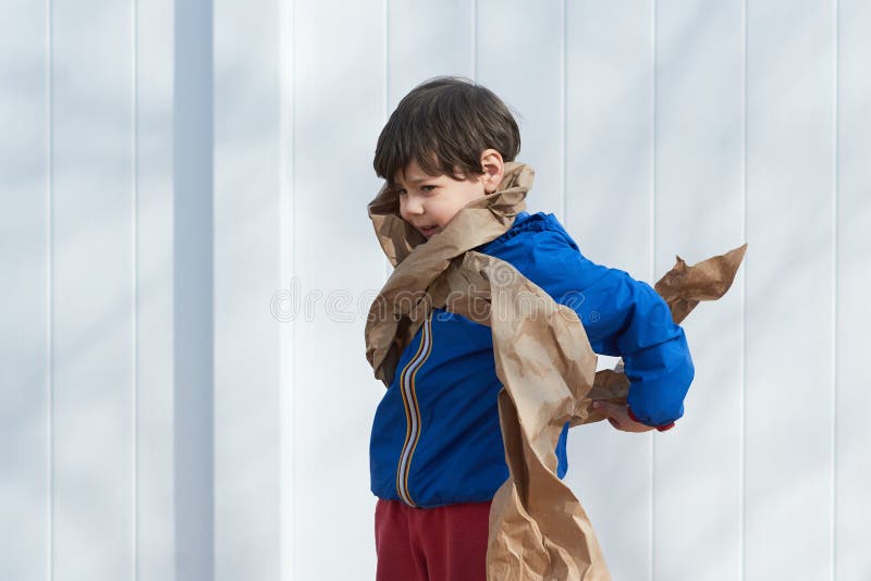 Young Boy Playing with Brown Packing Paper Stock Image - Image of ...