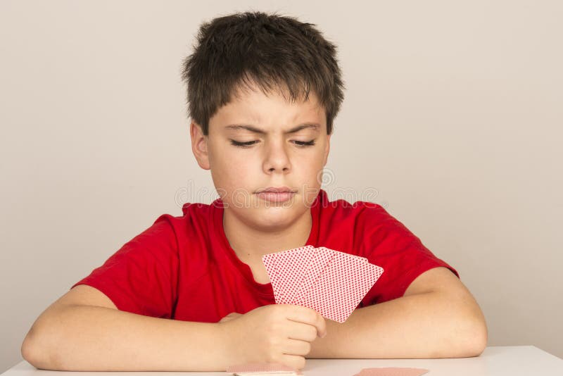 Young boy playing cards stock photo. Image of chance - 45536694