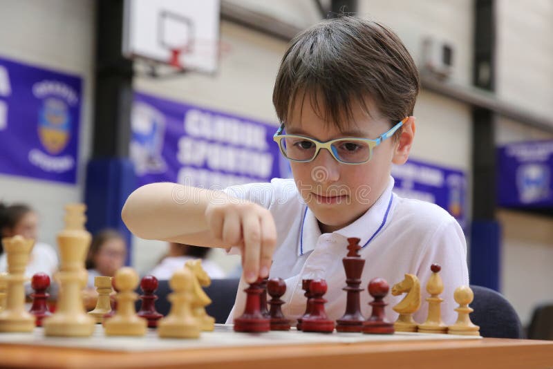 Young boy playing chess editorial stock image. Image of activity - 71622809