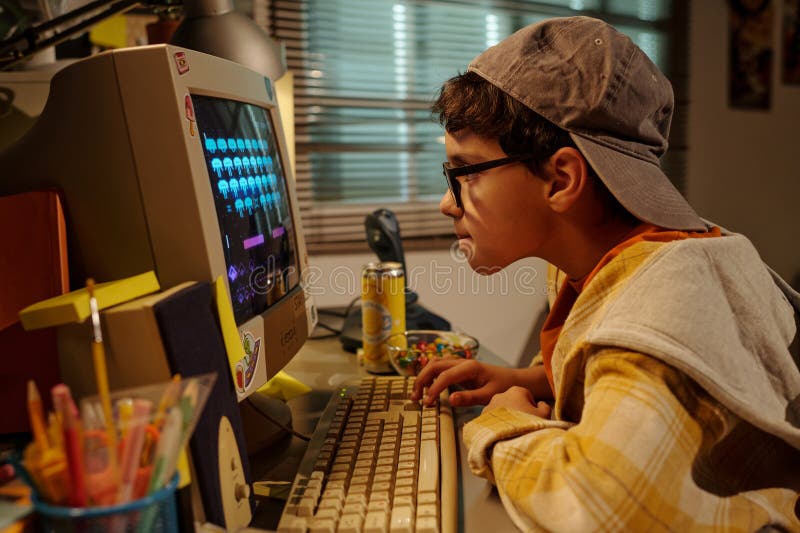 Young Boy Playing Classic Video Game on Computer at Home Stock Image ...