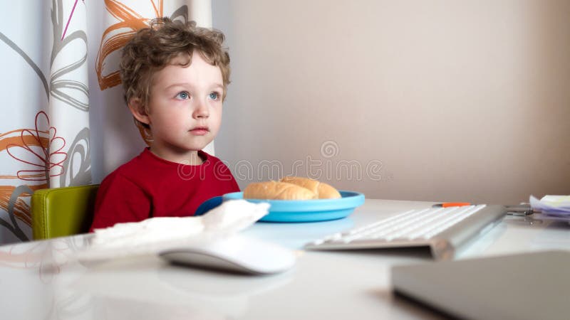 Young Boy Playing with Computer at Night Stock Photo - Image of ...