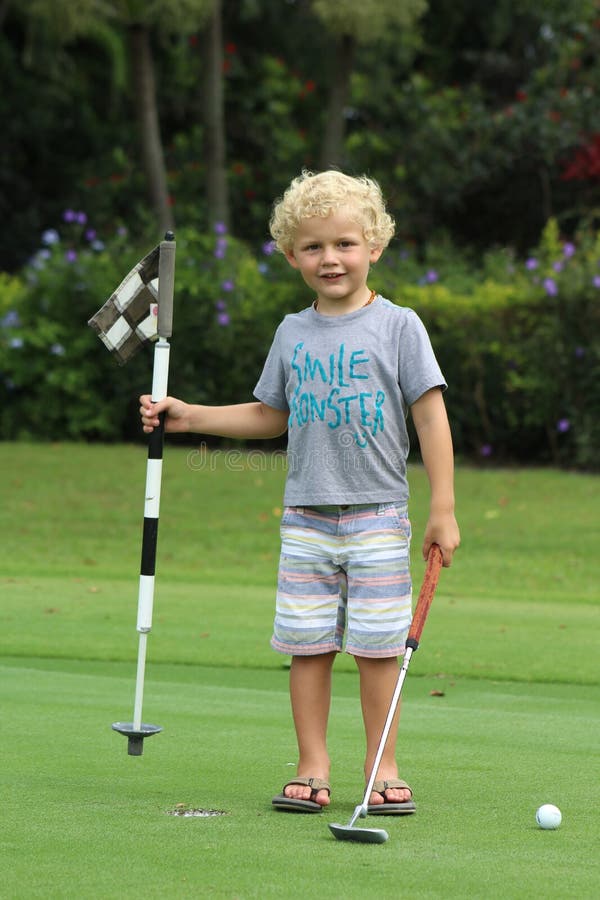 Young boy playing golf stock photo. Image of active - 107758396