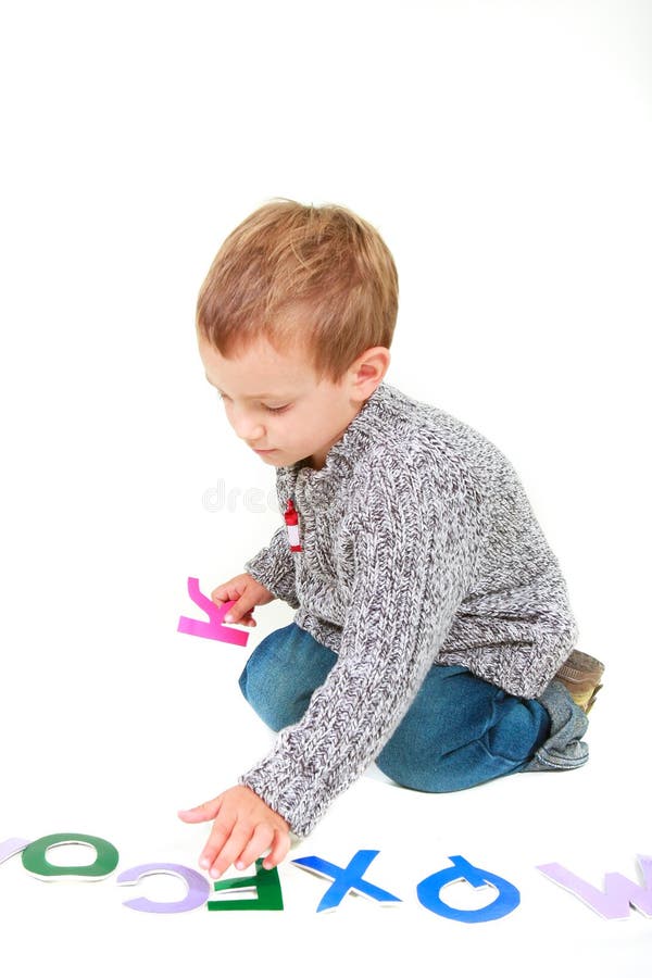 Young Boy Playing with Letters Stock Photo - Image of caucasian ...