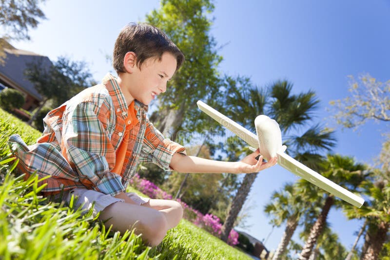 Young Boy Playing with Model Airplane Outside Stock Image - Image of ...