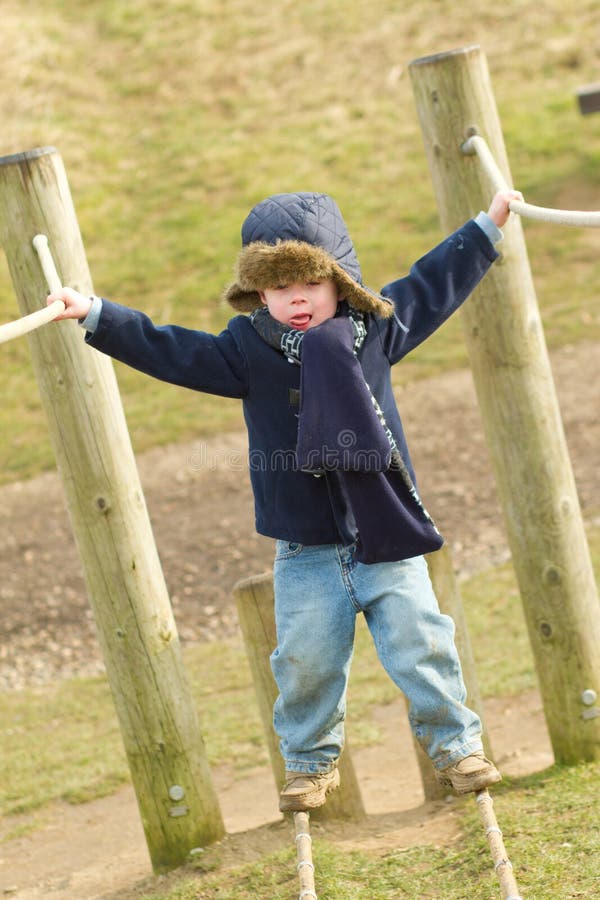 Young Boy Playing at the Park on a Cold Day Stock Photo - Image of back ...