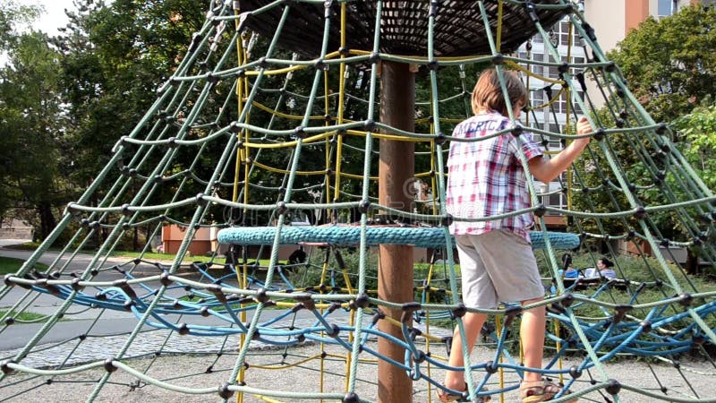 Young Boy Playing on Ropes in a Park Stock Footage - Video of ...