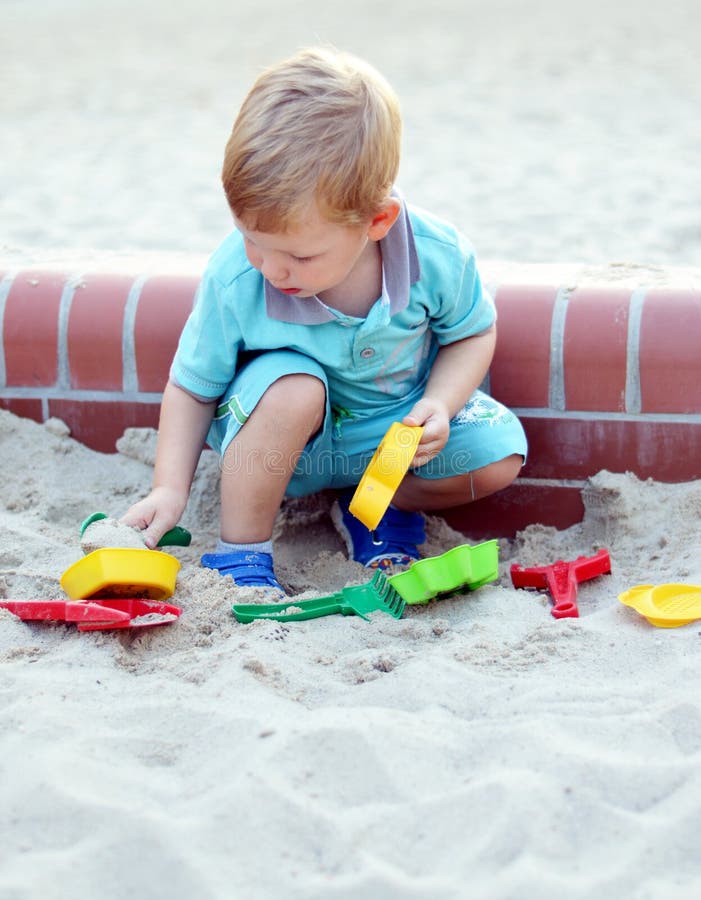 Young Boy Playing in the Sandbox Stock Image - Image of playground ...