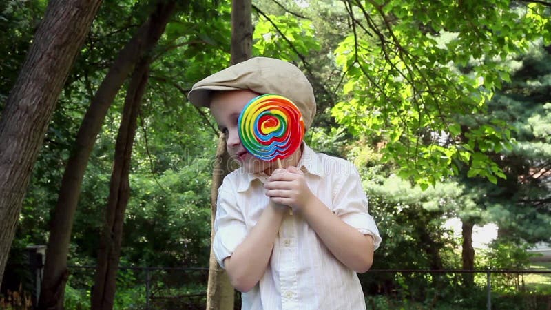 Child Licking Sucker stock photo. Image of adorable, cream - 12518426