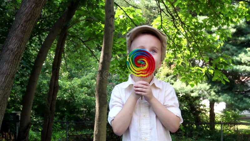 Child Licking Sucker stock photo. Image of adorable, cream - 12518426