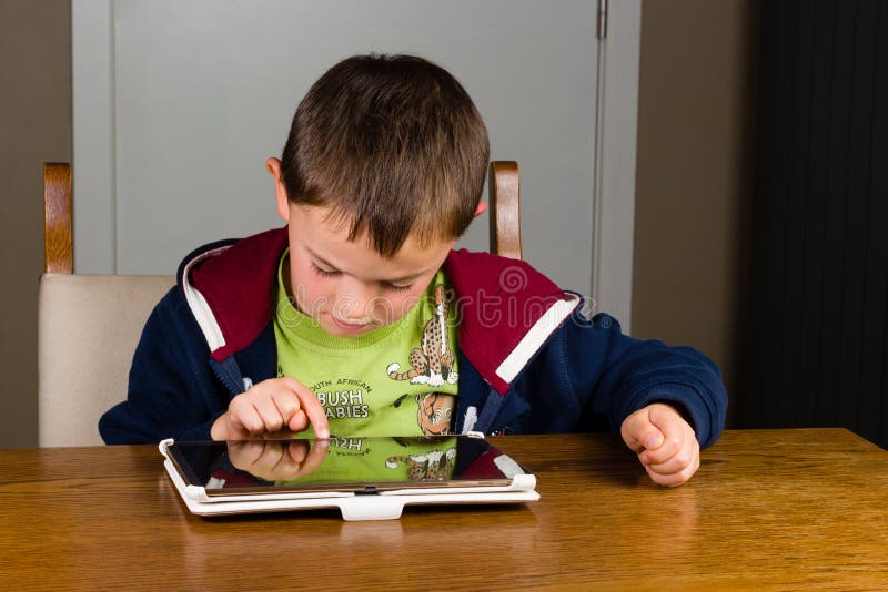 Young Boy Playing on Tablet Computer Stock Image - Image of touch ...