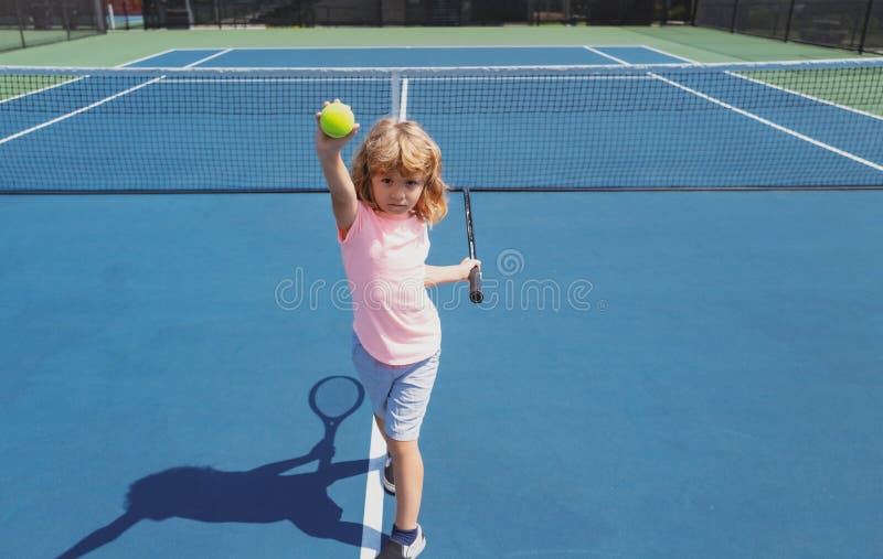 Young Boy Playing Tennis. Kid Hitting Forehand in Tennis. Stock Photo ...