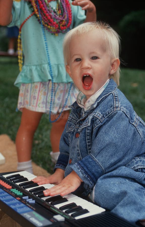 Young Boy Playing Toy Piano Editorial Photo - Image of keyboardists ...