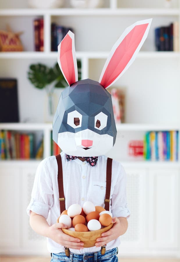 Young Boy in Polygonal Easter Bunny Rabbit Mask Posing with a Bowl Full ...