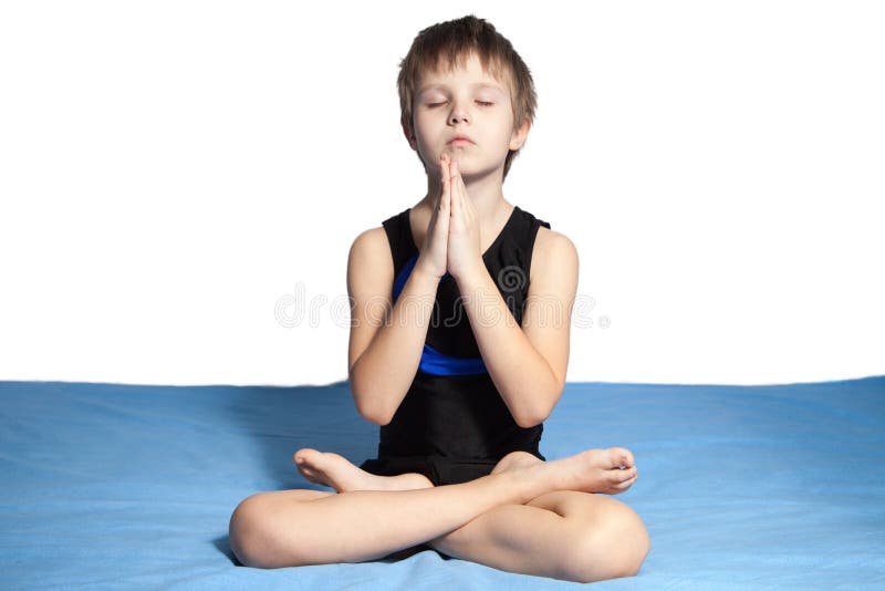 Young boy practices yoga stock image. Image of practice - 85555017