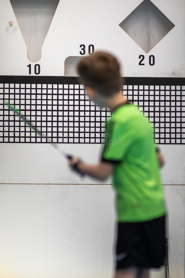 Young Boy Practising Accurate Badminton Serve Stock Image - Image of ...