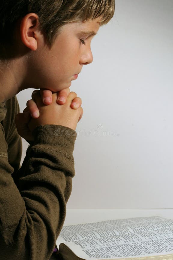 Young Boy Praying Over the Bible Stock Photo - Image of holy, devotion ...