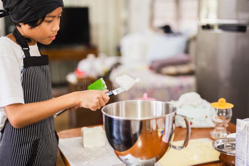 Young Boy Preparing Ingredient for Baking Cake in Kitchen. Stock Photo ...