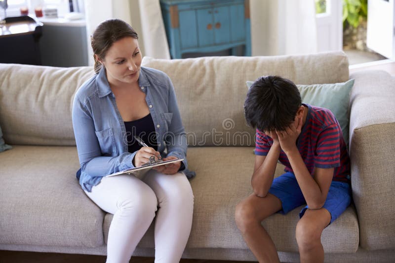 Teenage Boy with Problem Talking with Counselor at Home Stock Photo ...