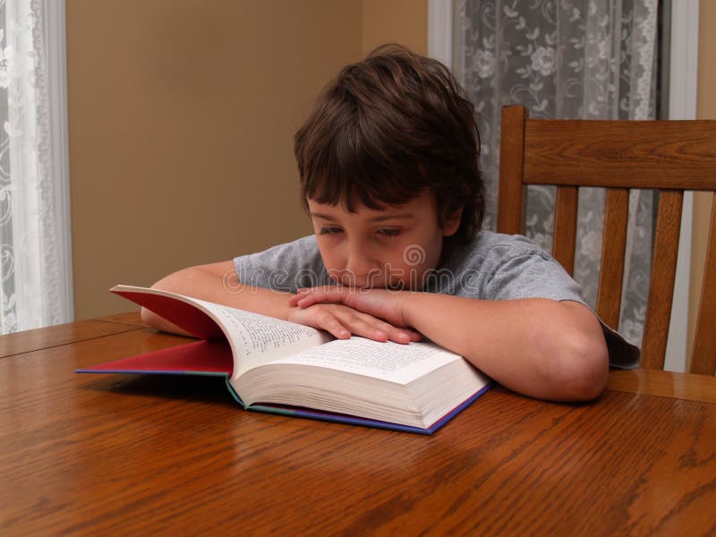 Young boy reading a book stock photo. Image of male, intellectual - 4162284