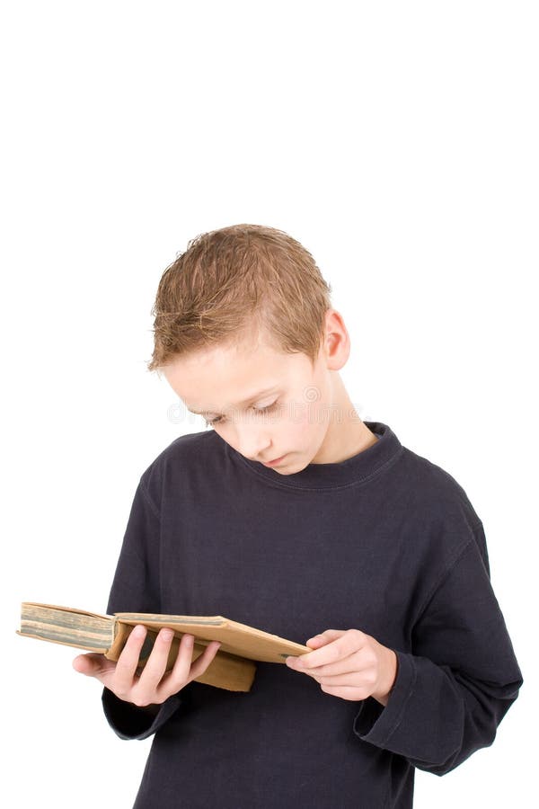 Young boy reading a book stock photo. Image of serious - 6885146
