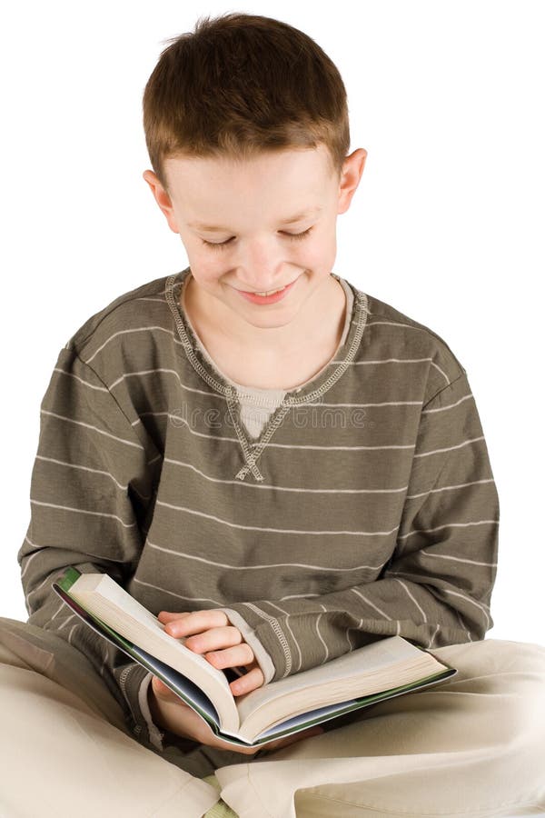 A young boy reading a book stock photo. Image of smiling - 9290500