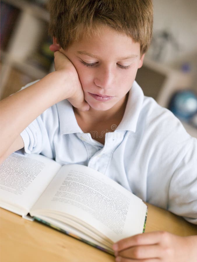 Young Boy Reading a Book in His Room Stock Image - Image of adolescent ...