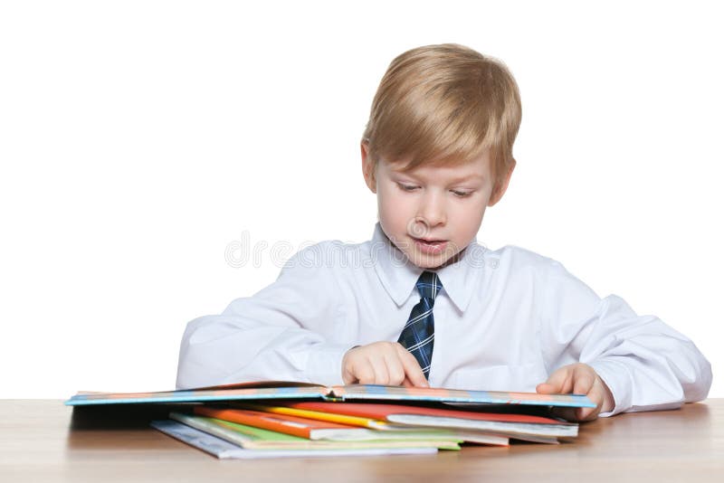 Young Boy is Reading at the Desk Stock Photo - Image of read, pensive ...