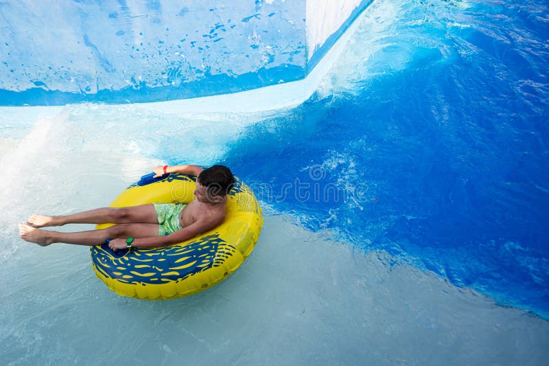 Young Boy Relaxing on Inflatable Ring in Swimming Pool at Aquapark ...