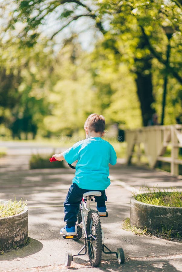 Young boy ride a bike stock photo. Image of outdoor - 142263566